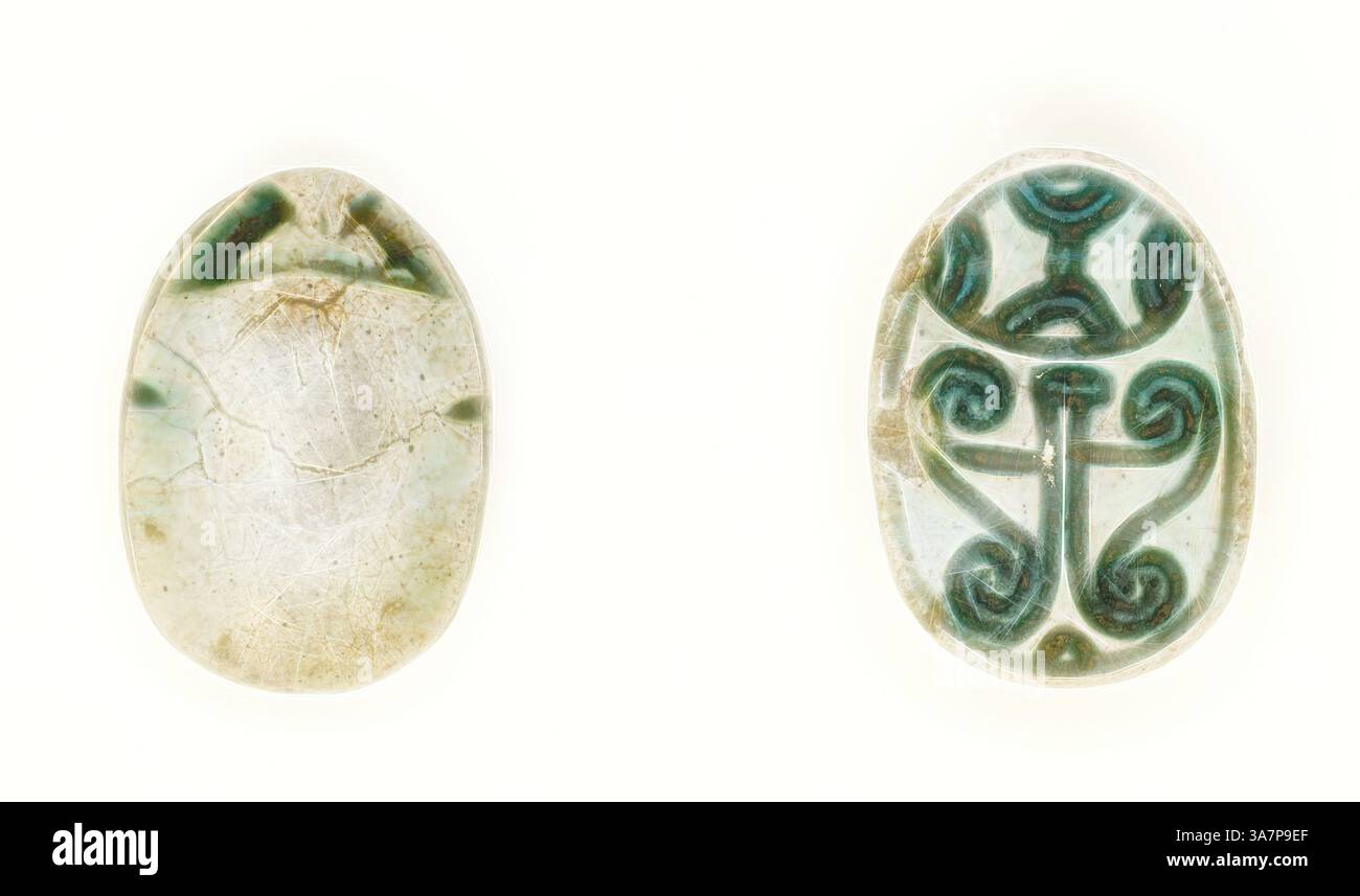 The image displays two intricately designed scarab amulets, each ...