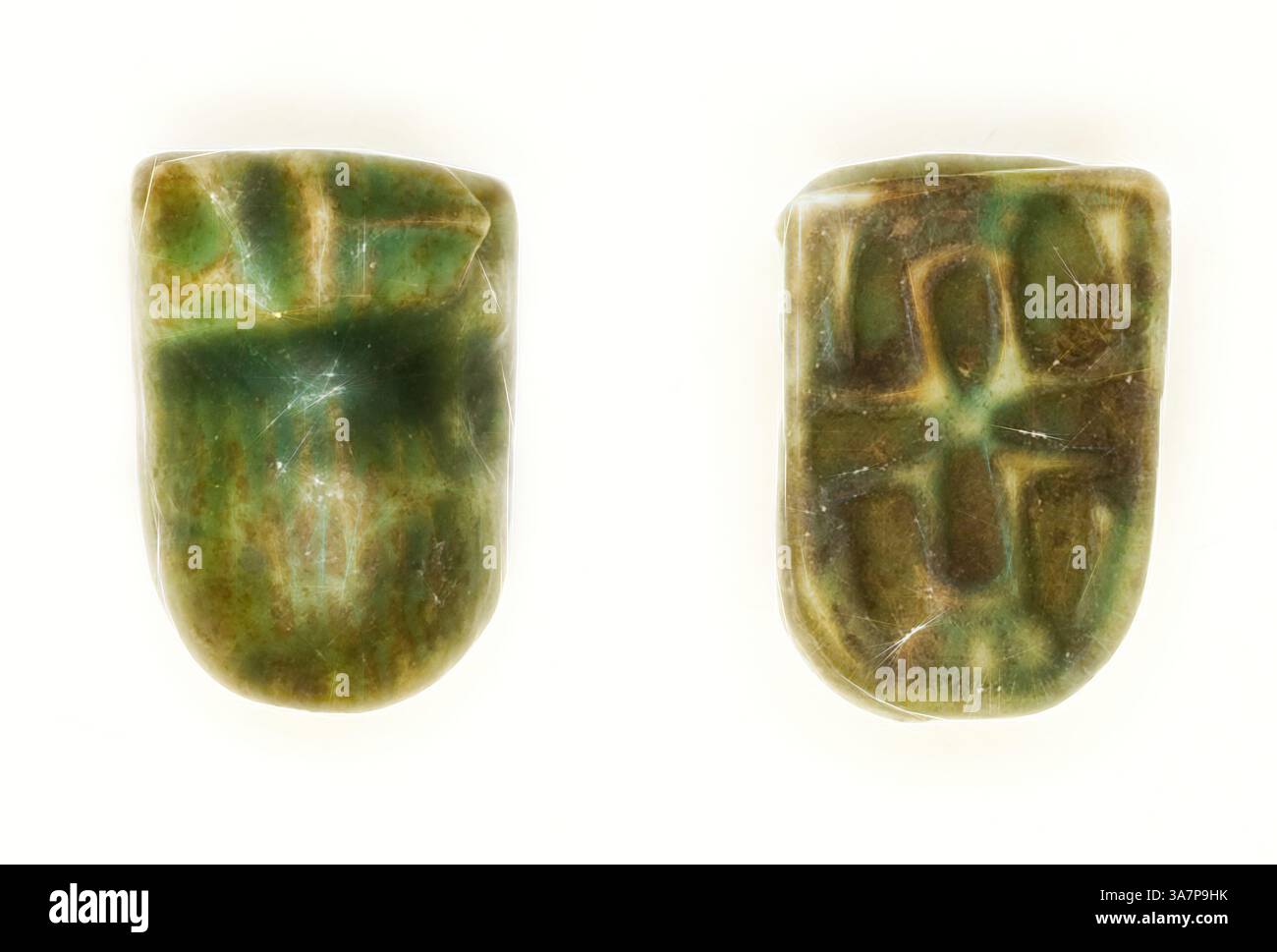 A smooth, polished stone artifact featuring intricate carvings on each ...