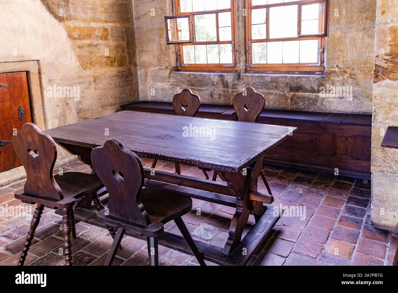 Old medieval interior setting - Old Royal Palace - Prague castle complex, Czech Republic. Dining ...