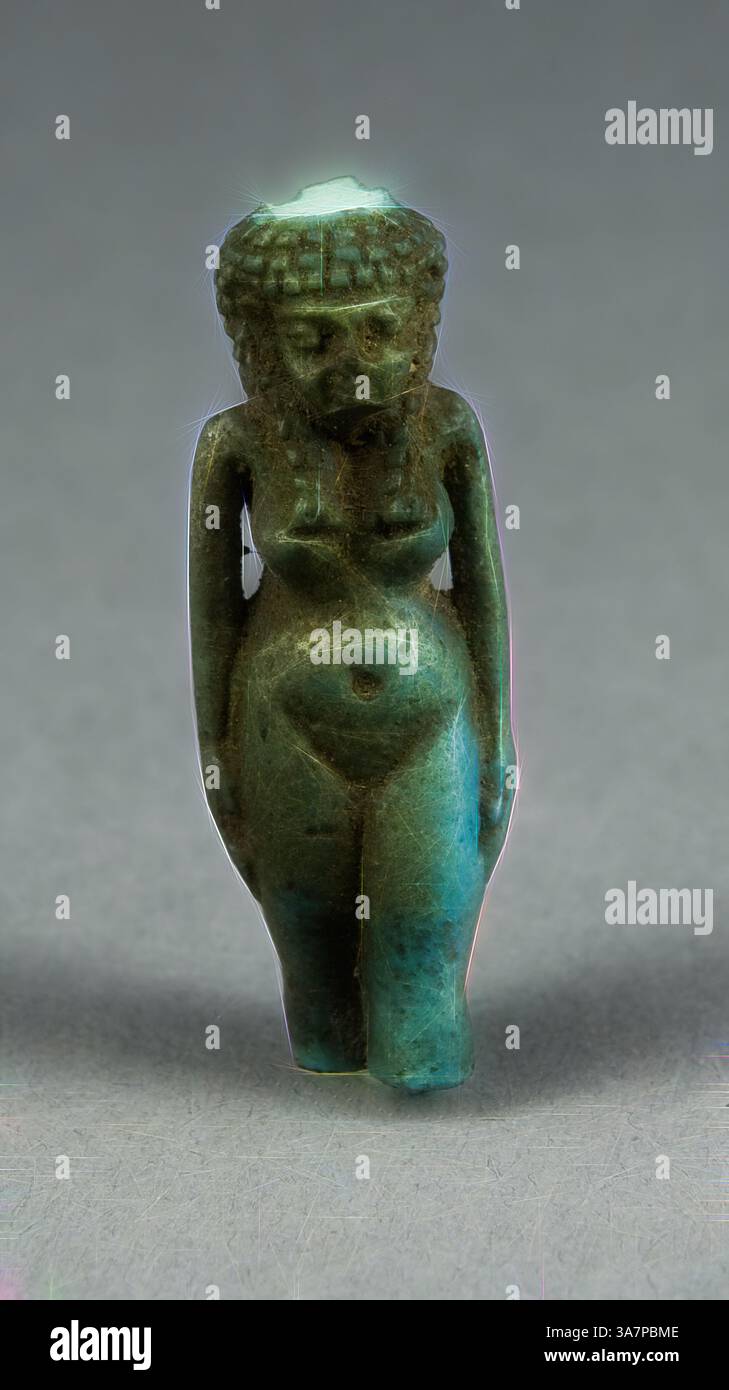 A small, intricately carved figurine of a woman, featuring detailed ...