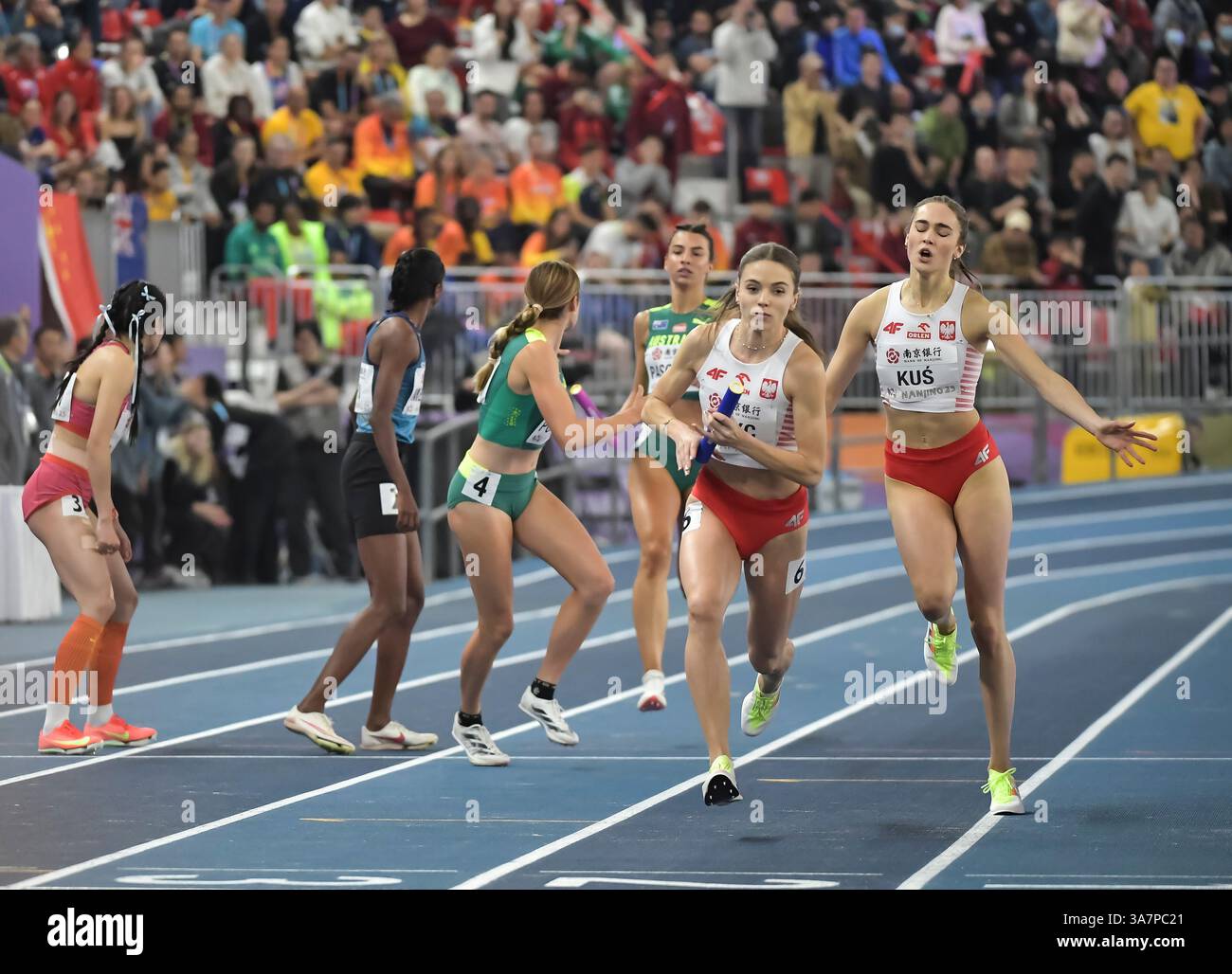 Anna Gryc of Poland competing in the women’s 4x400m relay change over ...
