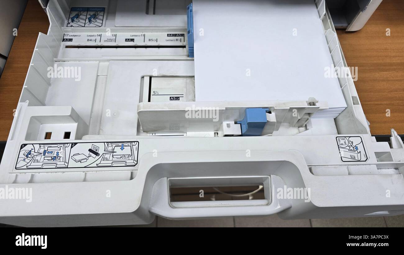 Printer tray full of white paper and ready for printing documents Stock ...