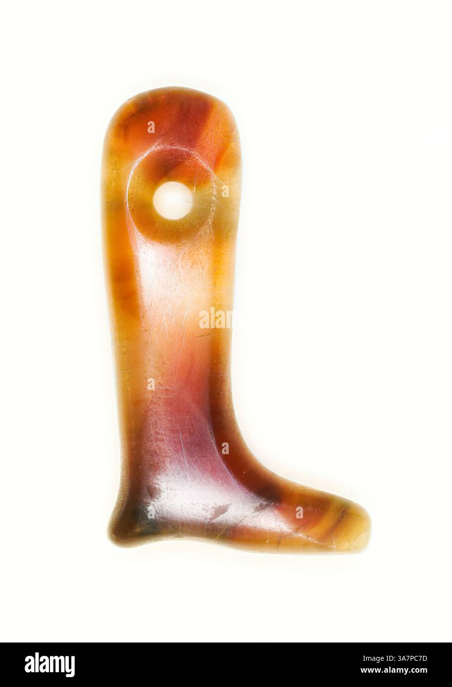 A carved stone piece resembling a stylized foot, showcasing a blend of ...