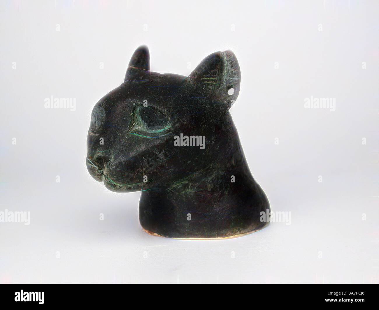 A finely crafted sculpture of a feline head, showcasing intricate ...