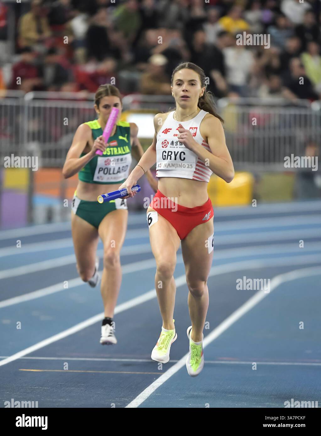Anna Gryc of Poland competing in the women’s 4x400m relay change over ...