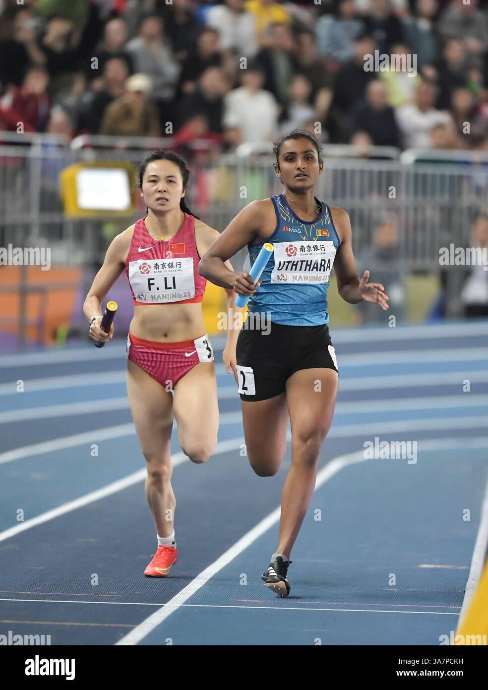 Fengdan Li of China and M.H.Jayeshi Uththara of Sri Lanka competing in ...