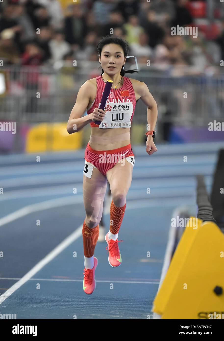 Yinglan Liu of China competing in the women’s 4x400m relay change over ...