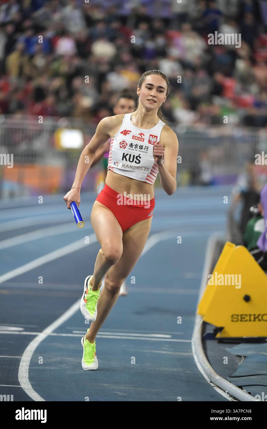 Anastazja Kuś of Poland competing in the women’s 4x400m relay change ...