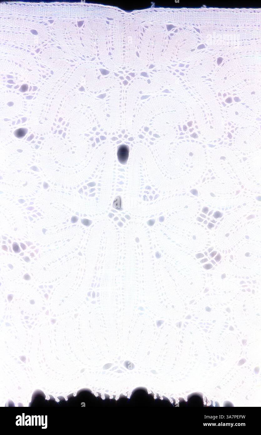 A delicate lace fabric features intricate patterns and cut-outs ...