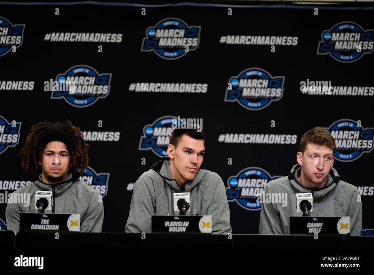 Michigan guard Tre Donaldson, left, Michigan center Vladislav Goldin ...