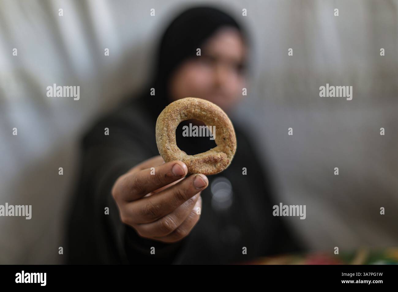 Palestinian families prepare the traditional cookies ahead of Eid al ...
