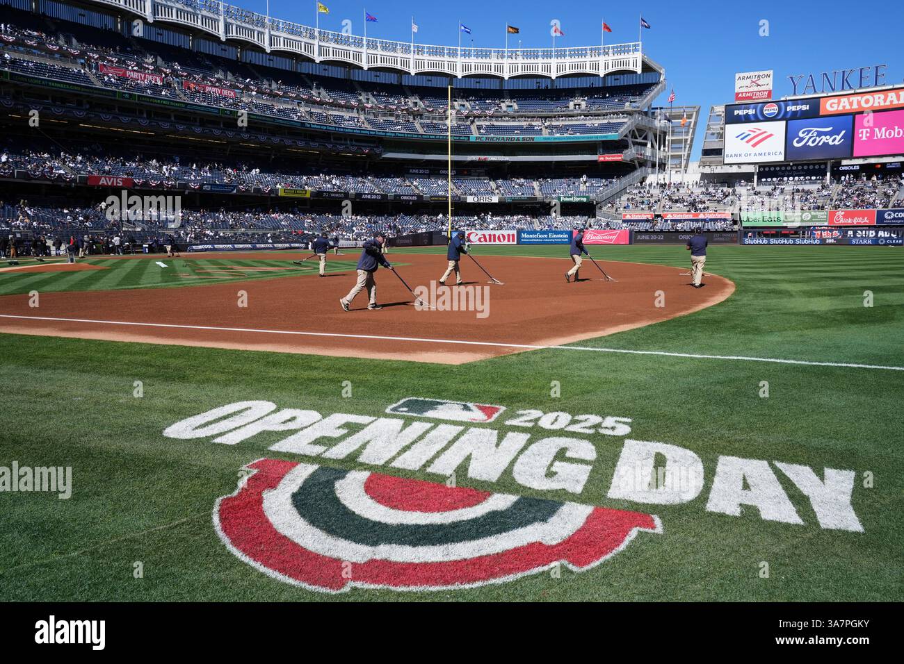 The grounds crew prepares the field before the start of an opening-day ...