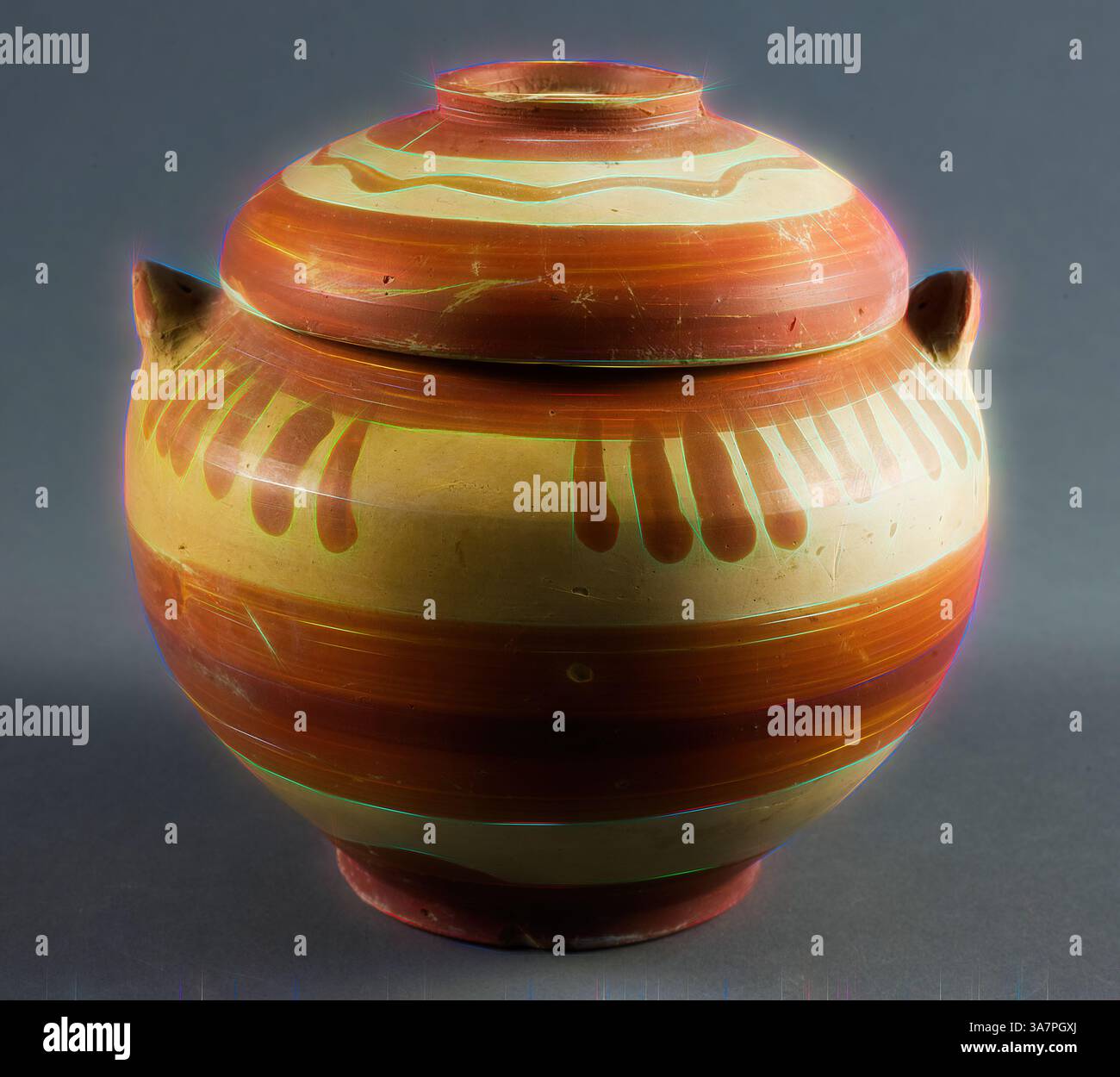 A beautifully crafted ceramic pot featuring vibrant, swirling patterns ...