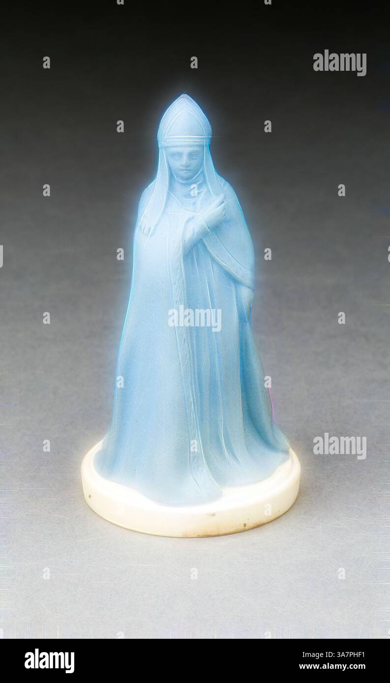 A delicate figurine of a cloaked figure, characterized by a serene ...