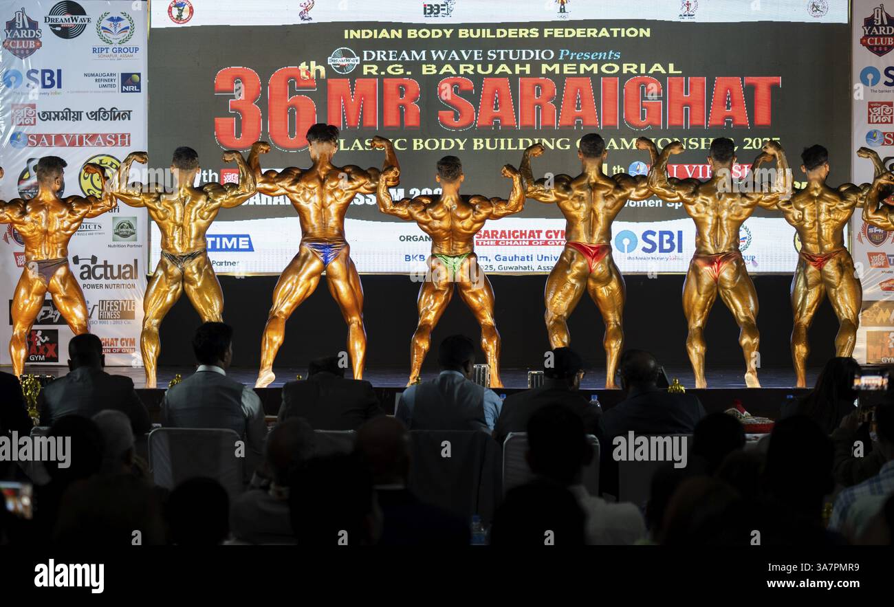 Male bodybuilding competitors flex their muscles as they compete during ...