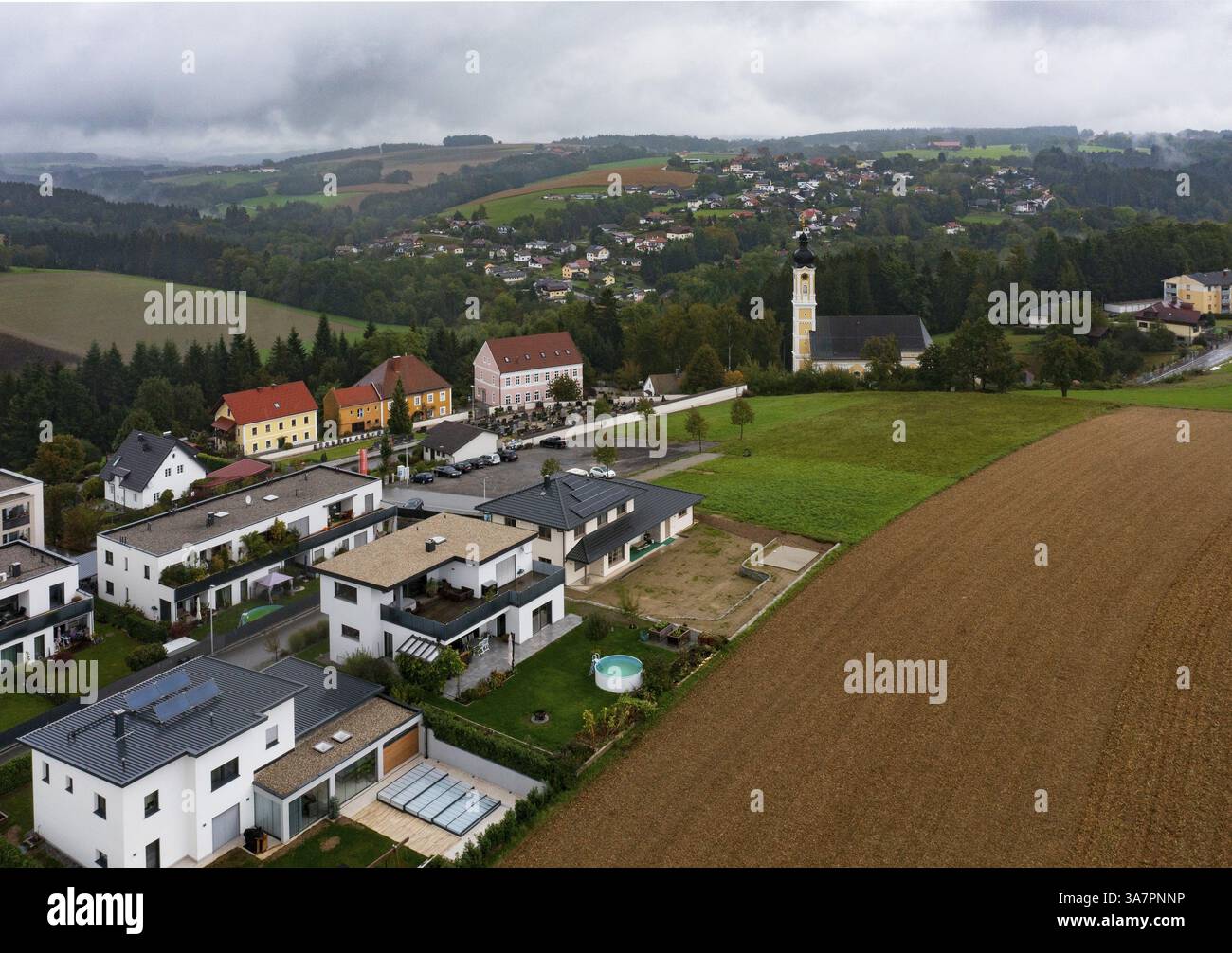 Drone image, residential buildings, view of village with church ...