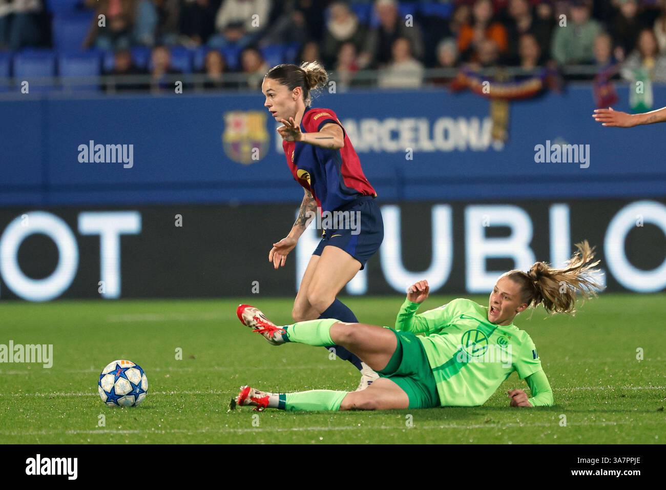 Barcelona's Maria Leon, left is tackled by Wolfsburg's Vivien Endemann ...