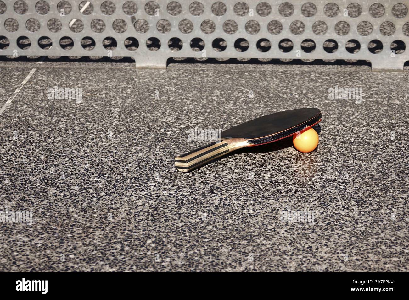 Outdoor table tennis table with ball and bat, Germany, Europe Stock ...