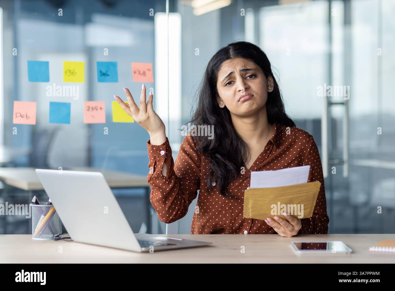 Portrait of upset and disappointed woman at workplace inside office ...