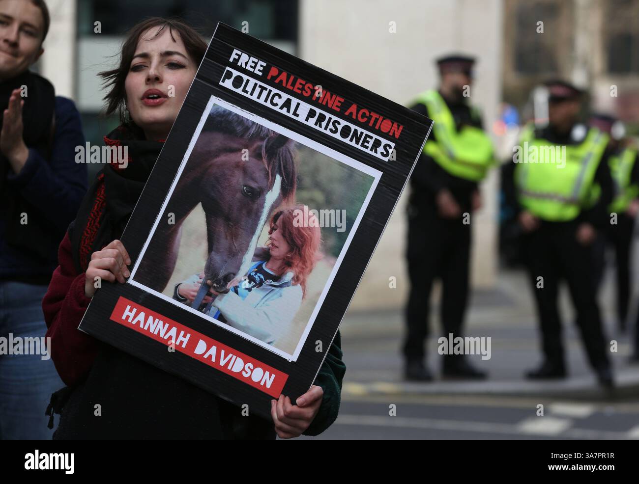 March 27, 2025, London, England, UK: A protester holds a photo sign of ...