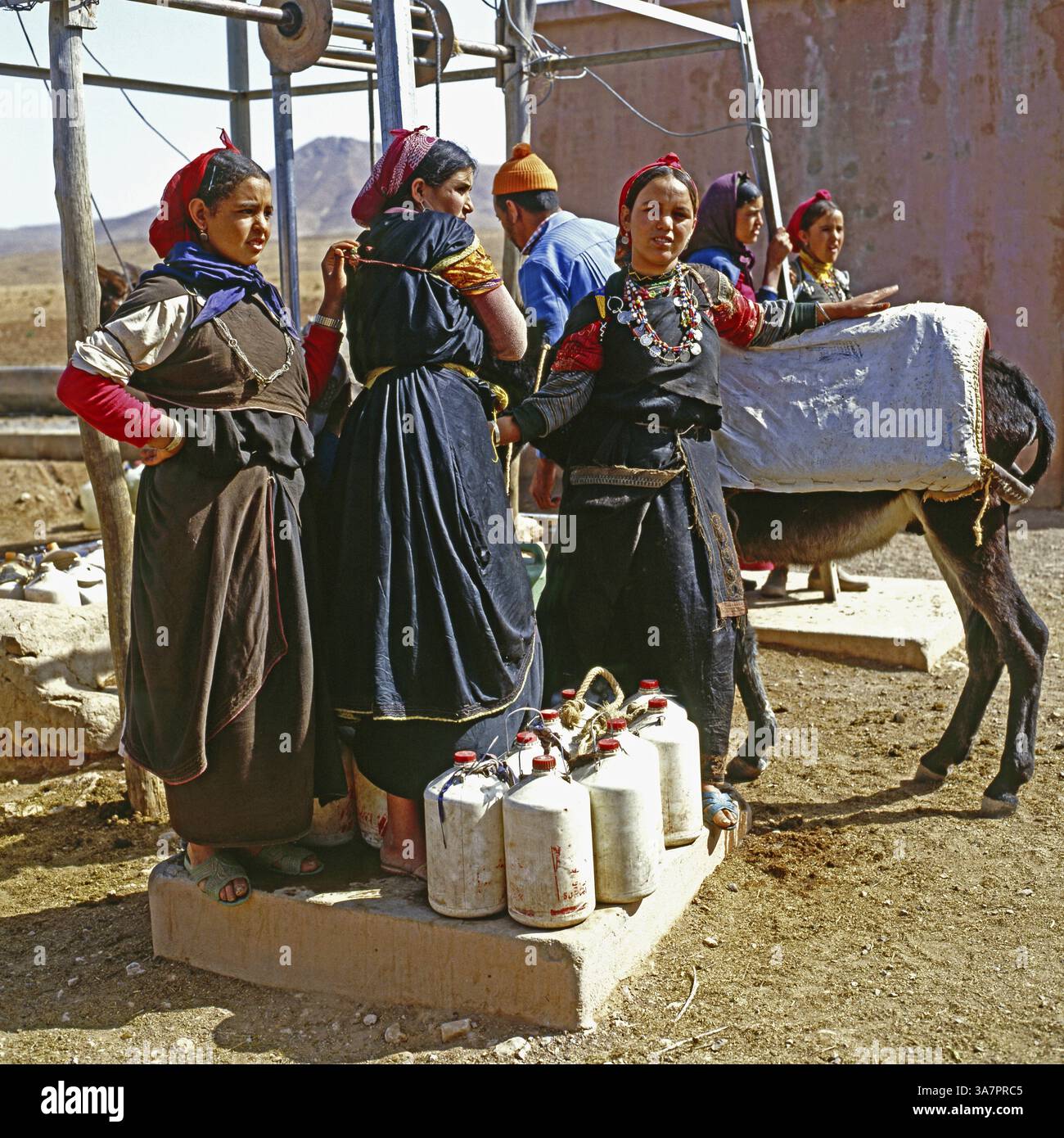 Berber woman fetch water from a well in Ouzzoum, Morocco, Africa Stock ...