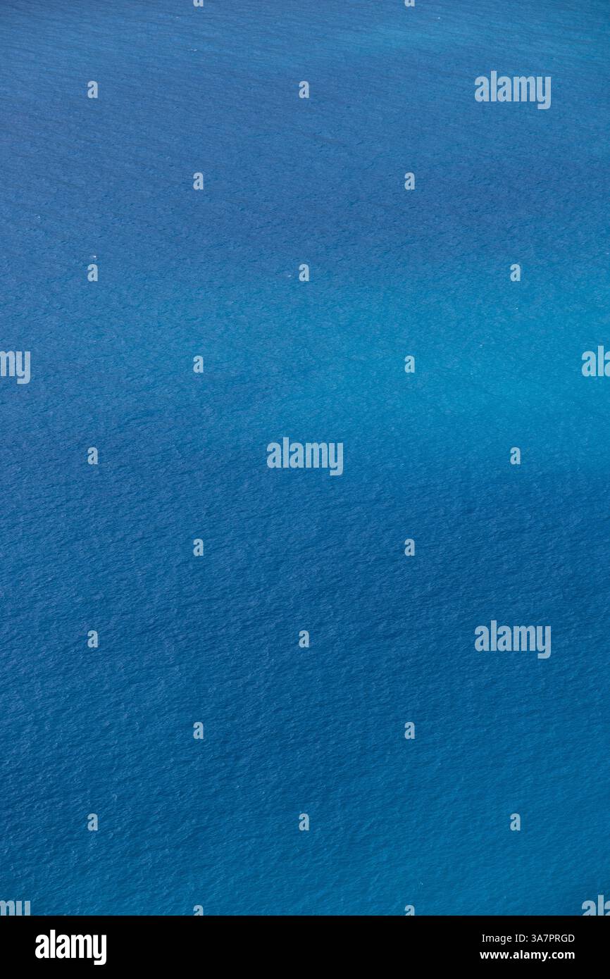 A textured view of deep blue sea water in Greece, showing natural waves ...