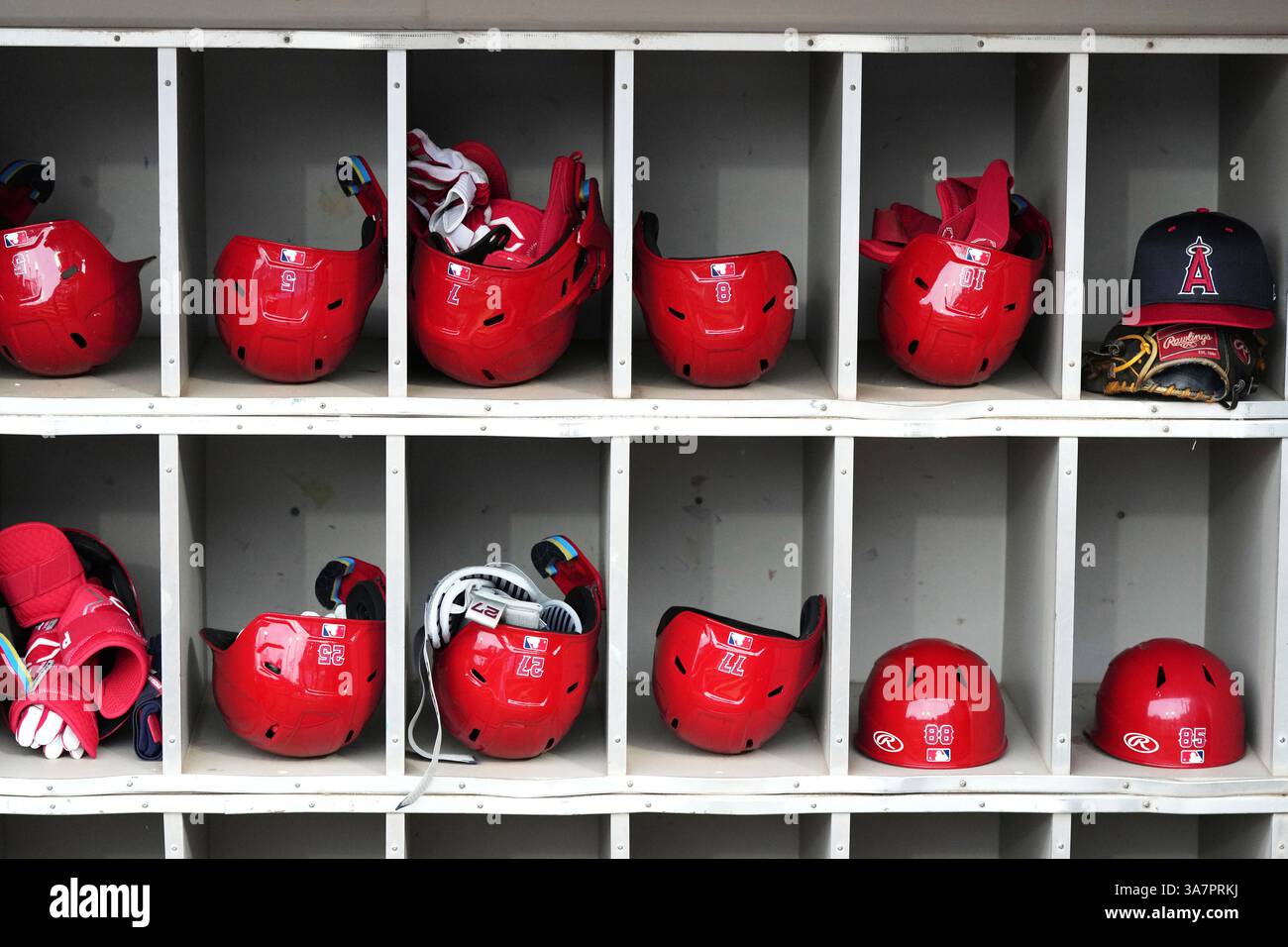 Los Angeles Angels batting helmets sit in cubbies in the visitors ...
