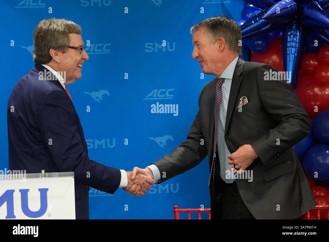 SMU incoming president Jay Hartzell, right, shakes hands with current ...