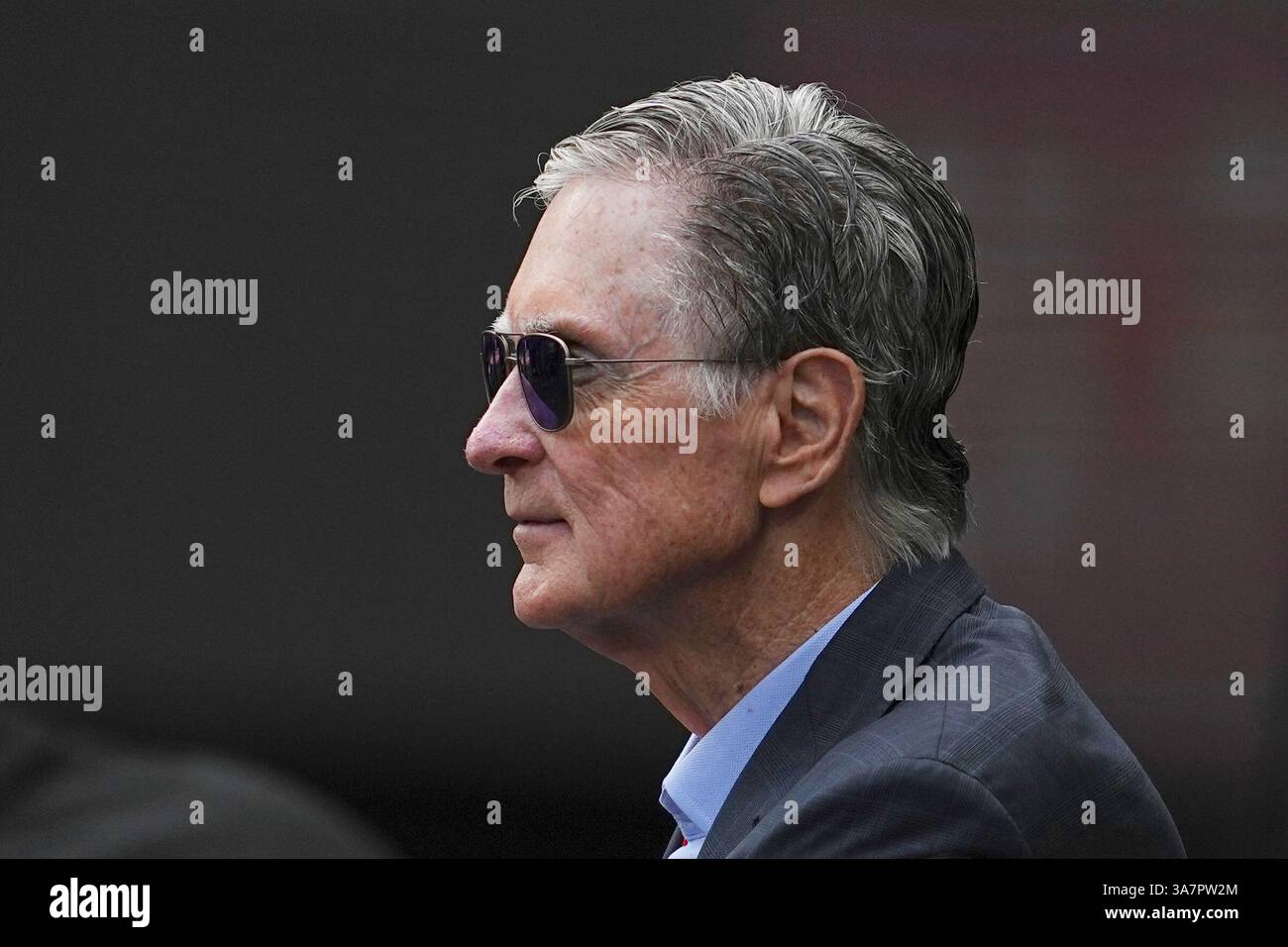 Boston Red Sox owner John Henry stands in the dugout before an opening ...
