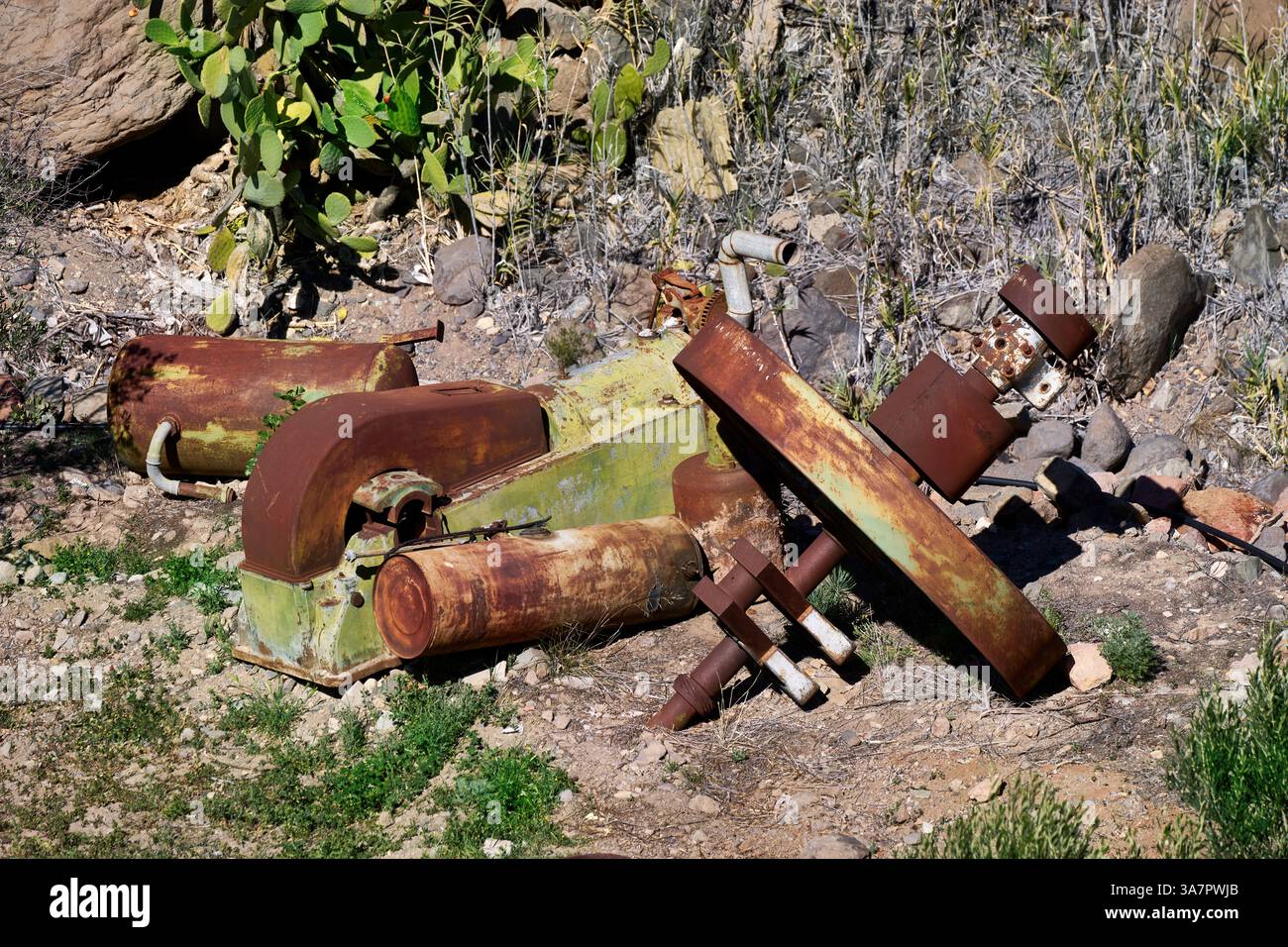 Old large rusted metal parts of machines lie outdoors Stock Photo - Alamy