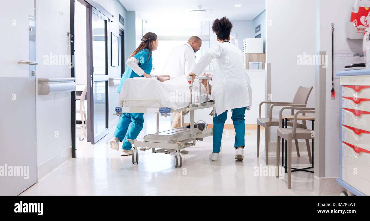 Running, hospital and doctors with stretcher in hallway for emergency ...