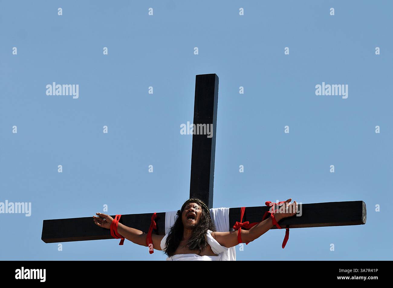 March 29, 2013 - Manila, Philippines - Penitent RUBEN ENAJE grimaces in ...