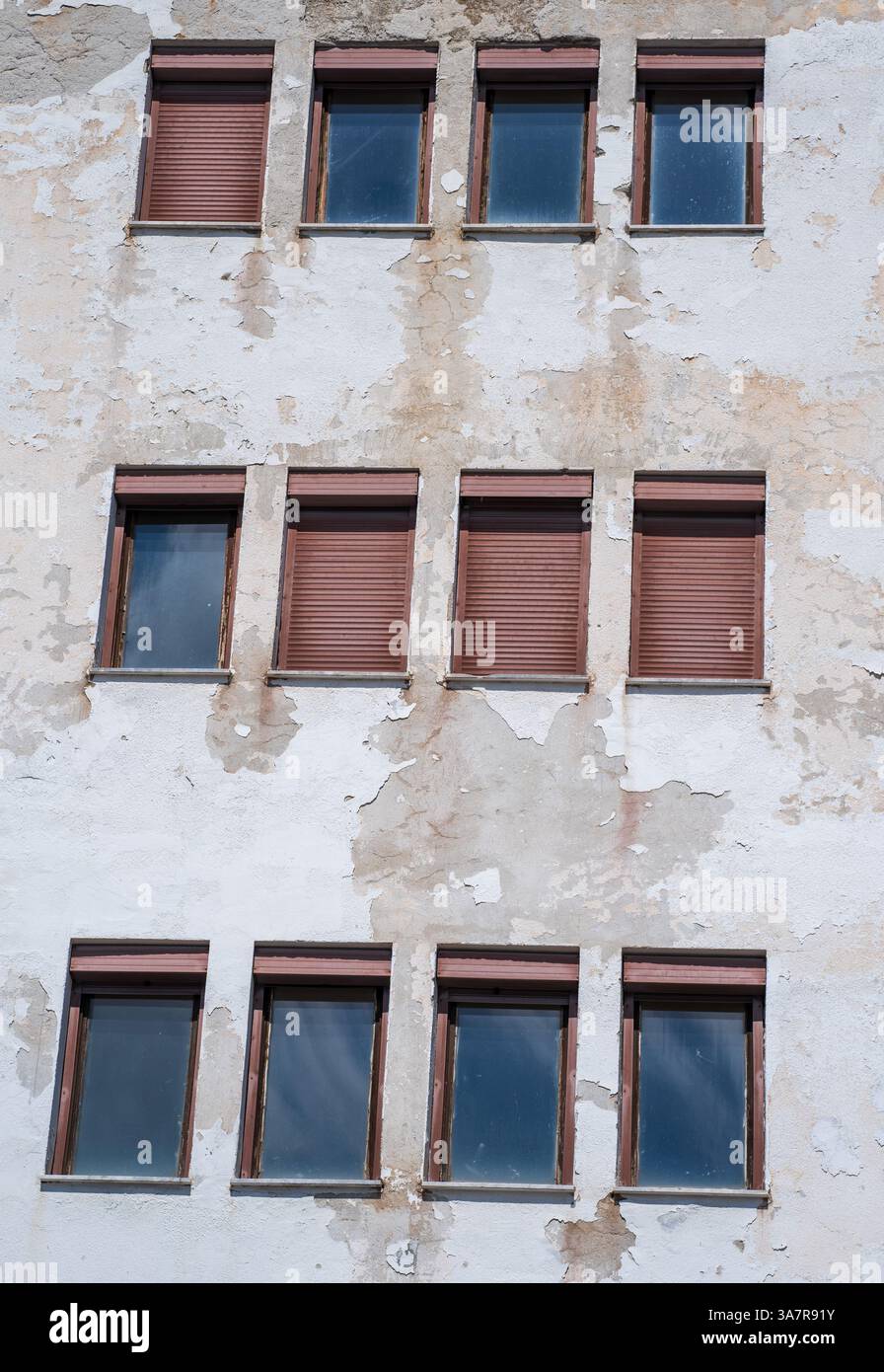 Weathered Symmetry – Old Building's 12 Windows Stock Photo - Alamy
