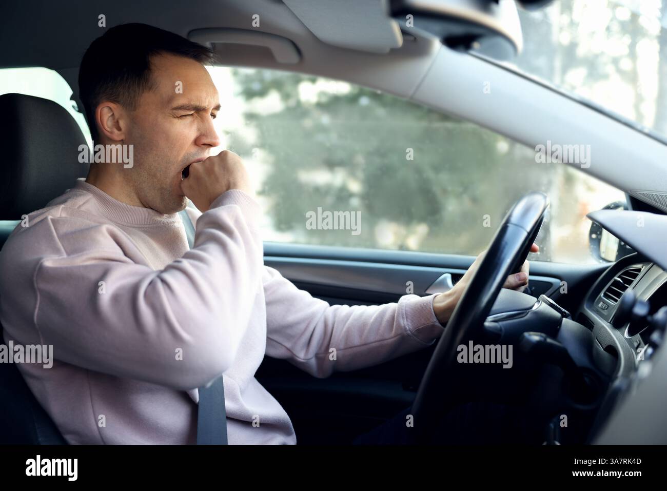Sleepy driver yawning in his modern car Stock Photo - Alamy