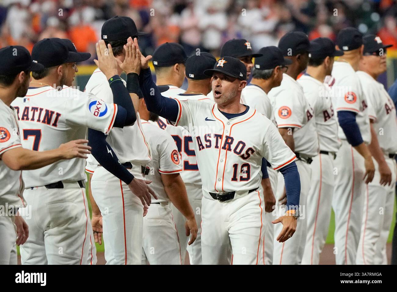 Houston Astros manager Joe Espada (19) greets players before an opening ...