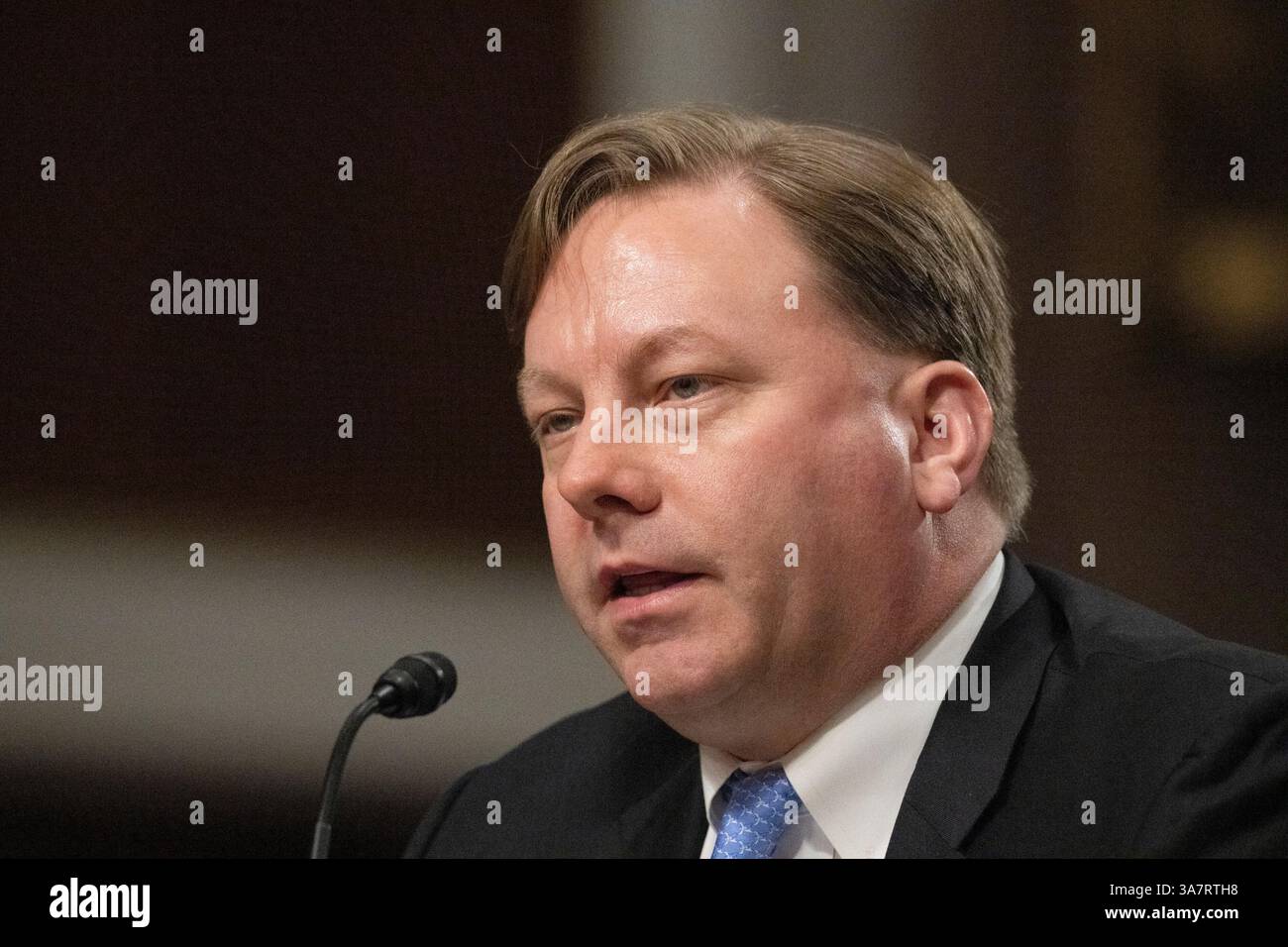 Michael Duffy makes opening remarks at a Senate Committee on Armed ...