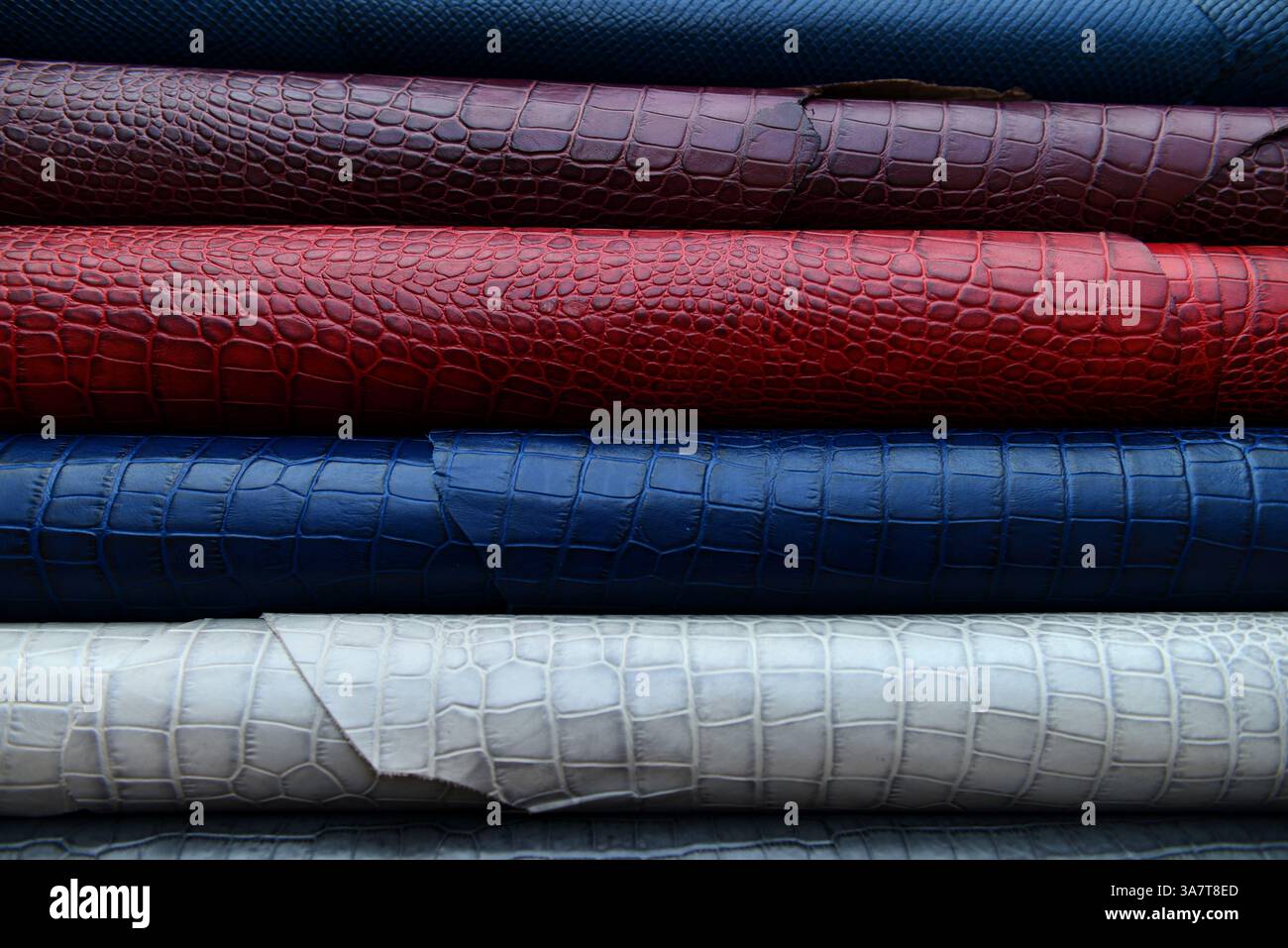 stack of Rolled leather sheets in various colors and textures Stock ...