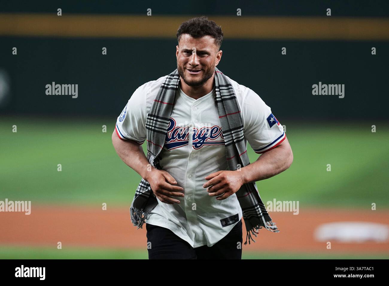 AEW wrestler Maxwell Jacob Friedman jogs off the mound after throwing ...