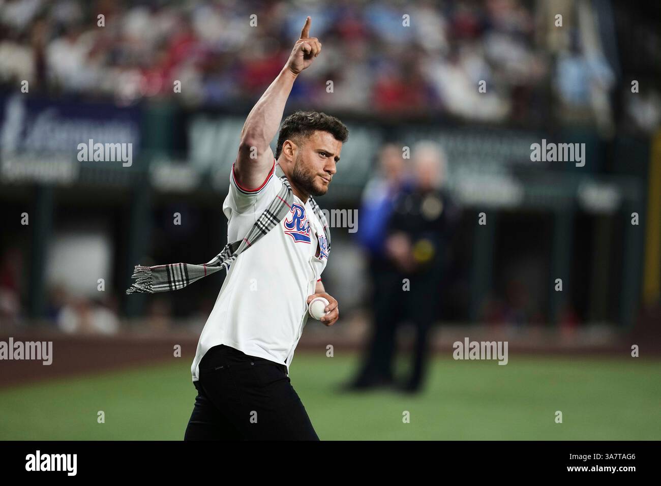 AEW wrestler Maxwell Jacob Friedman jogs onto the field to throw out ...