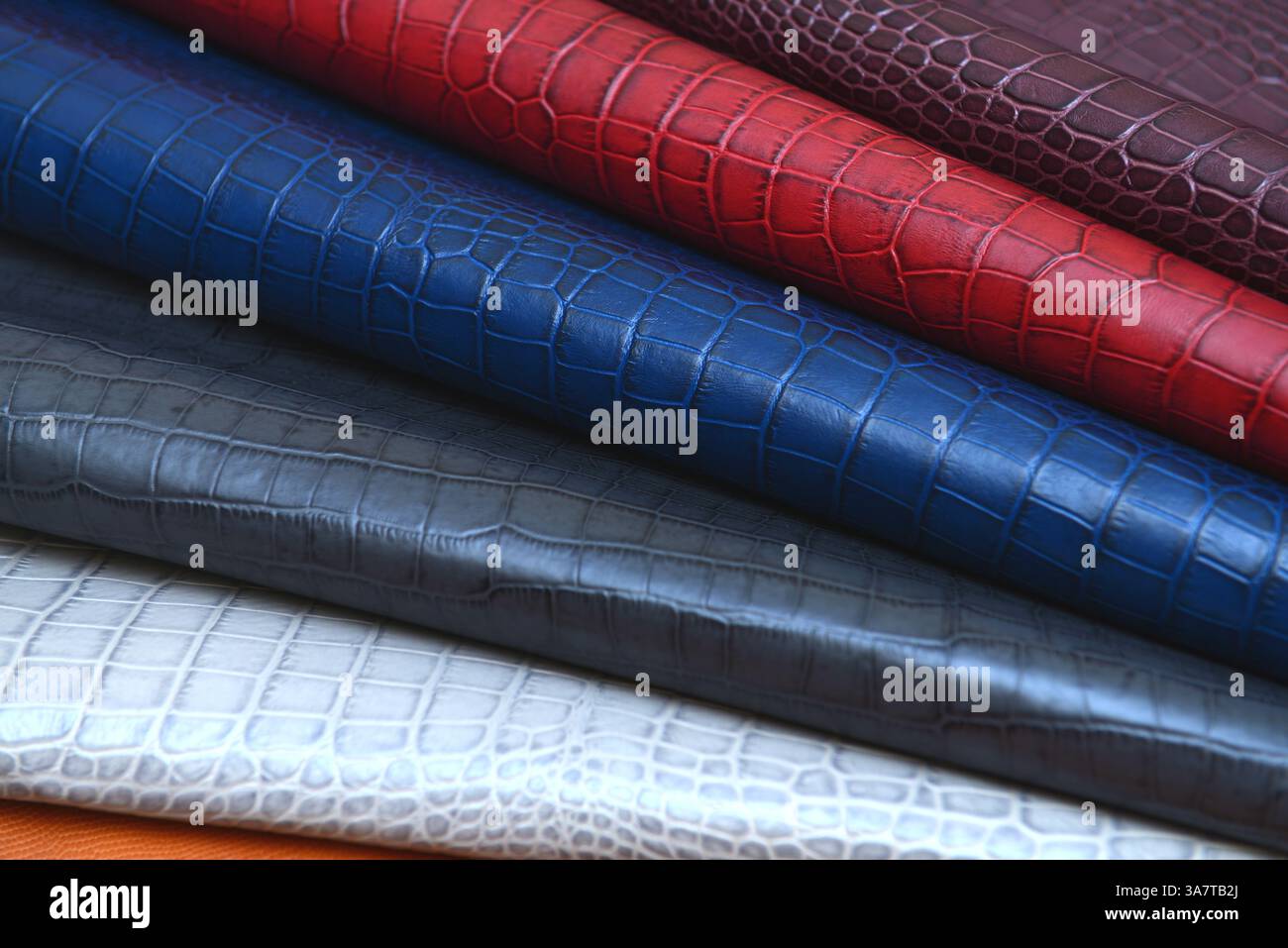 Crocodile Leather Rolls Display in vibrant colors Stock Photo - Alamy