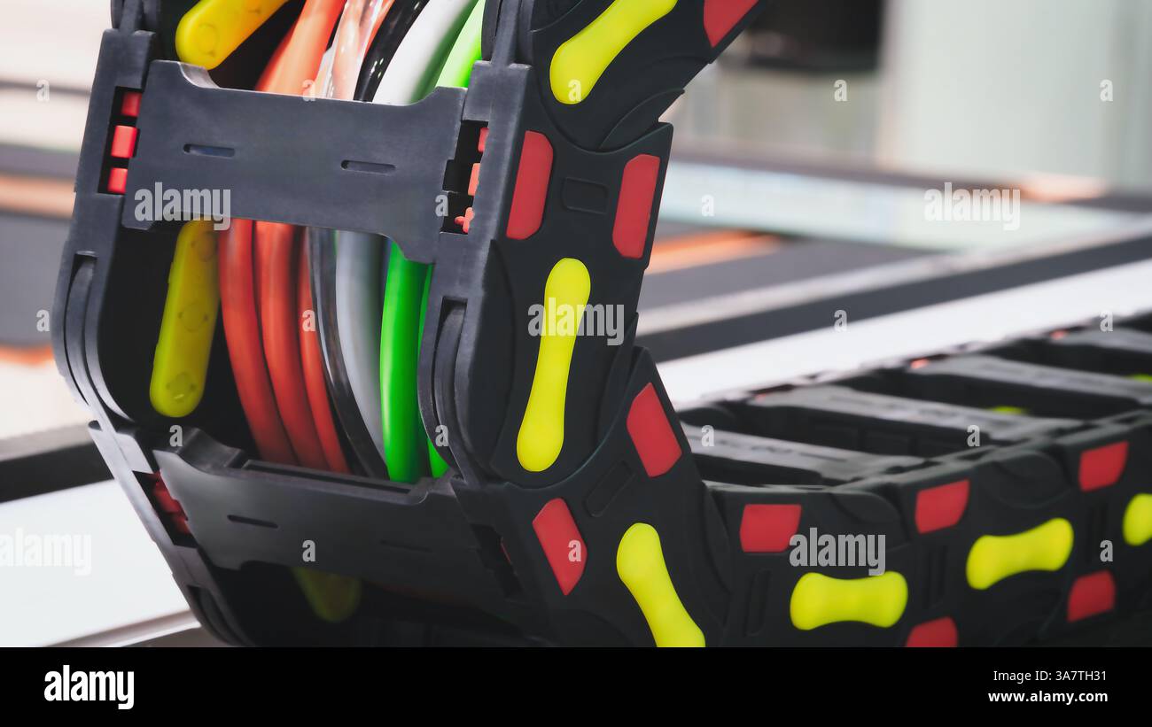 A cable management system with a black and yellow design. The cables ...