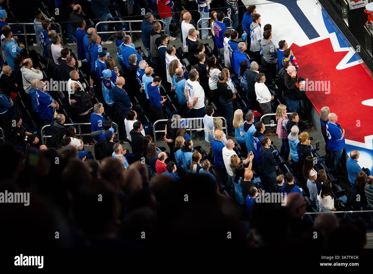 Fans stand for the American national anthem ahead of the Toronto Blue ...