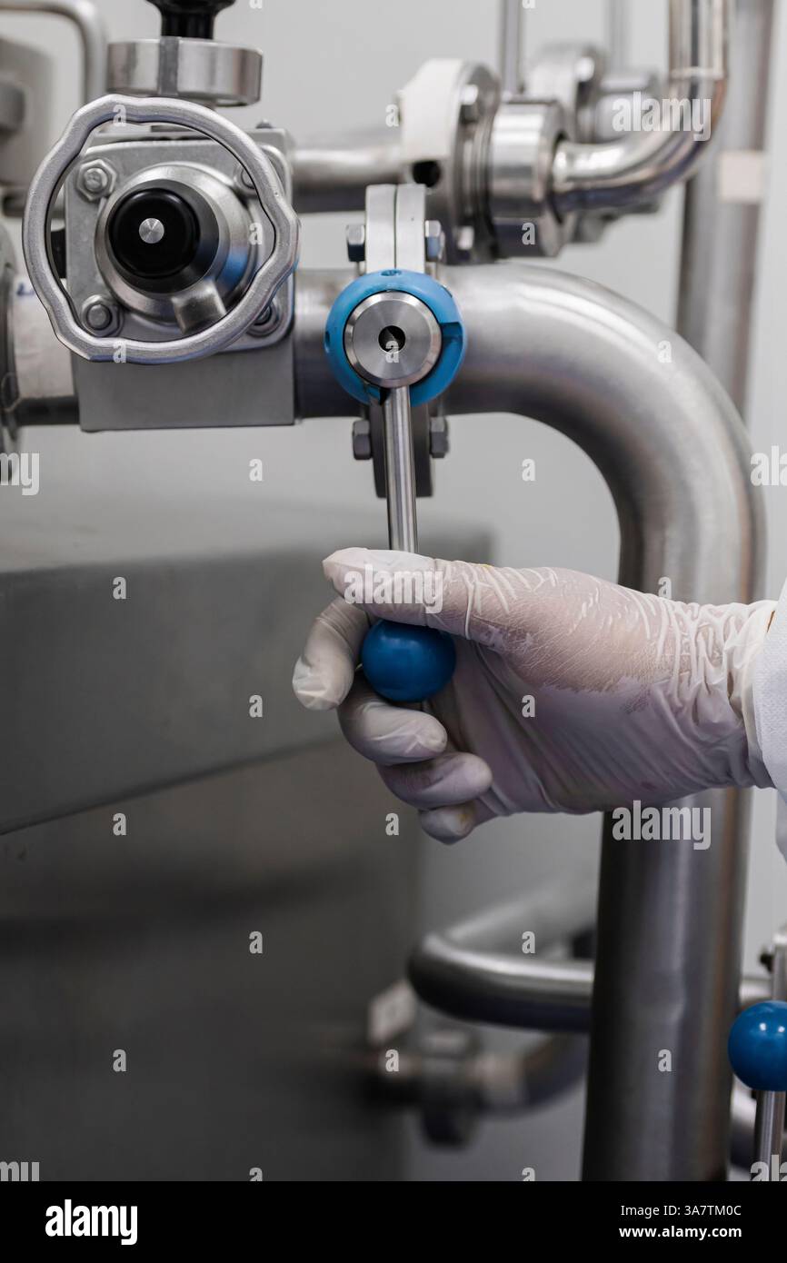 Pharmaceutical factory workers operate hi-res stock photography and ...
