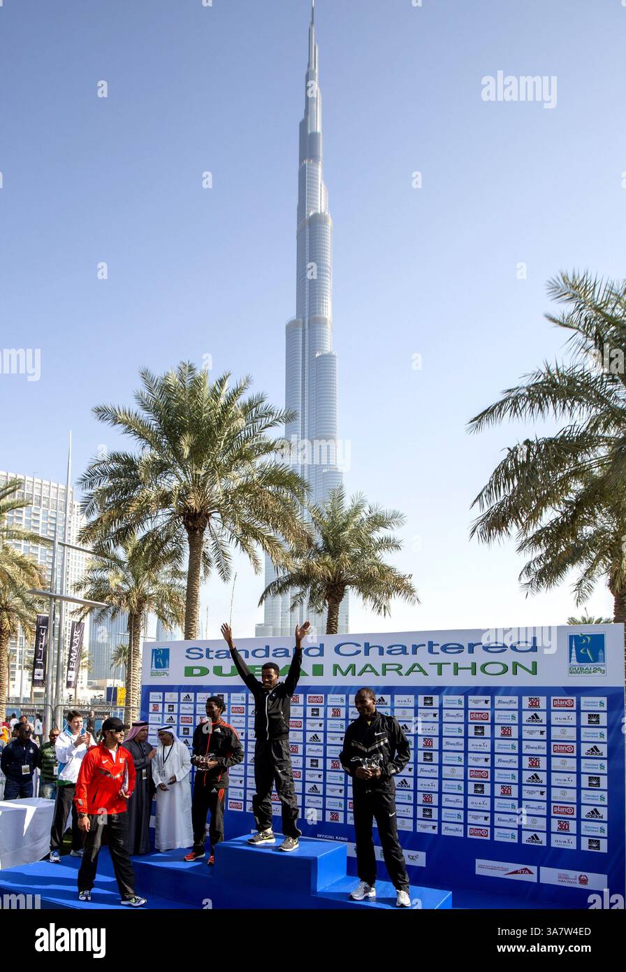 Jan. 25, 2013 - Dubai, UAE - The men's winners on the podium with Burj ...