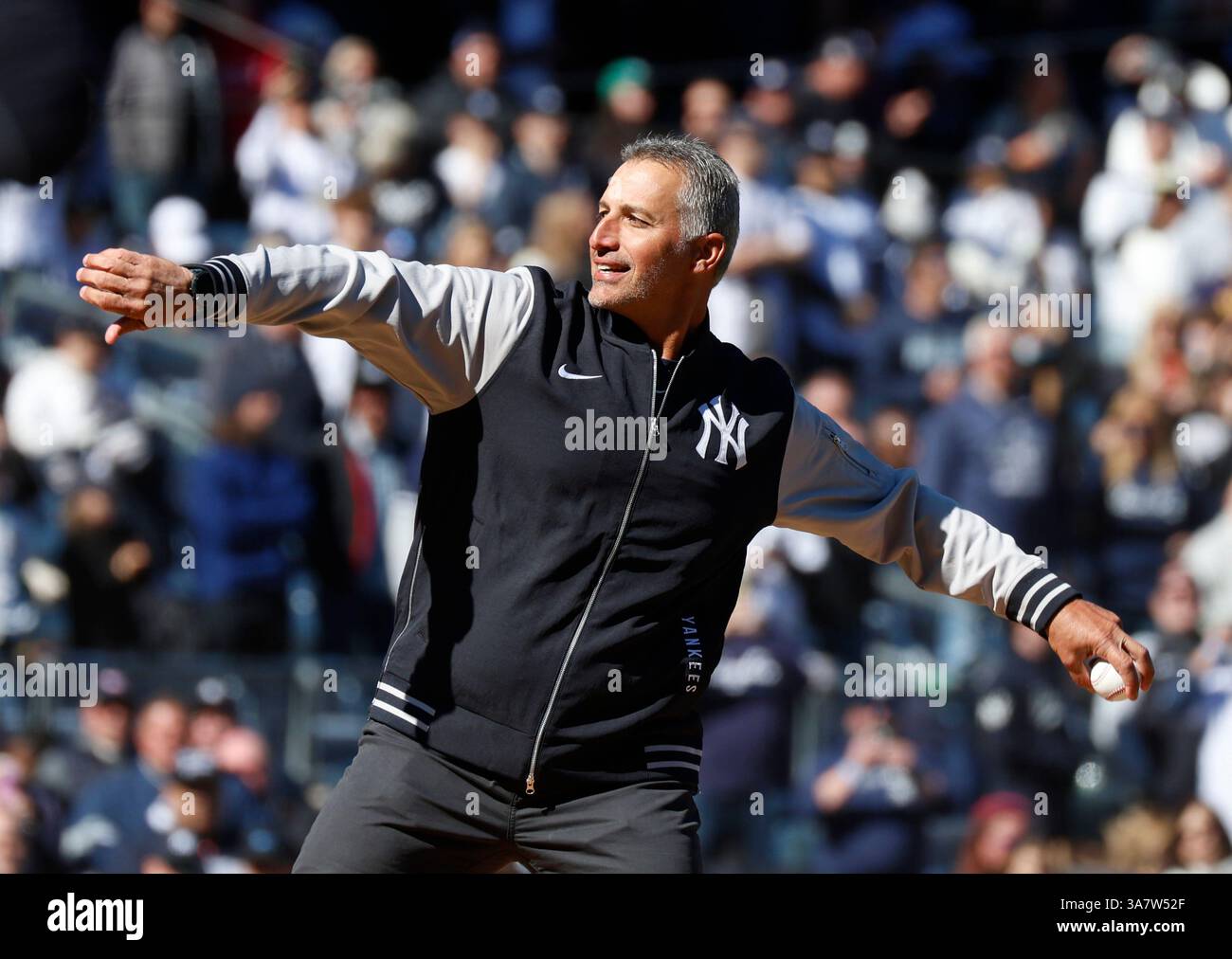 Former New York Yankees pitcher Andy Pettitte throws out the first pitch before the game against ...