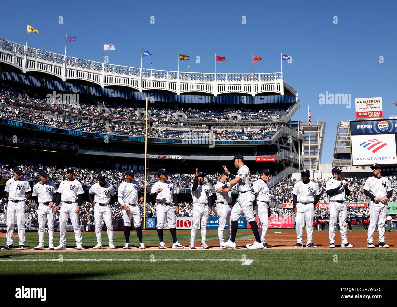 New York Yankees Aaron Judge greets teammates on the first base line ...