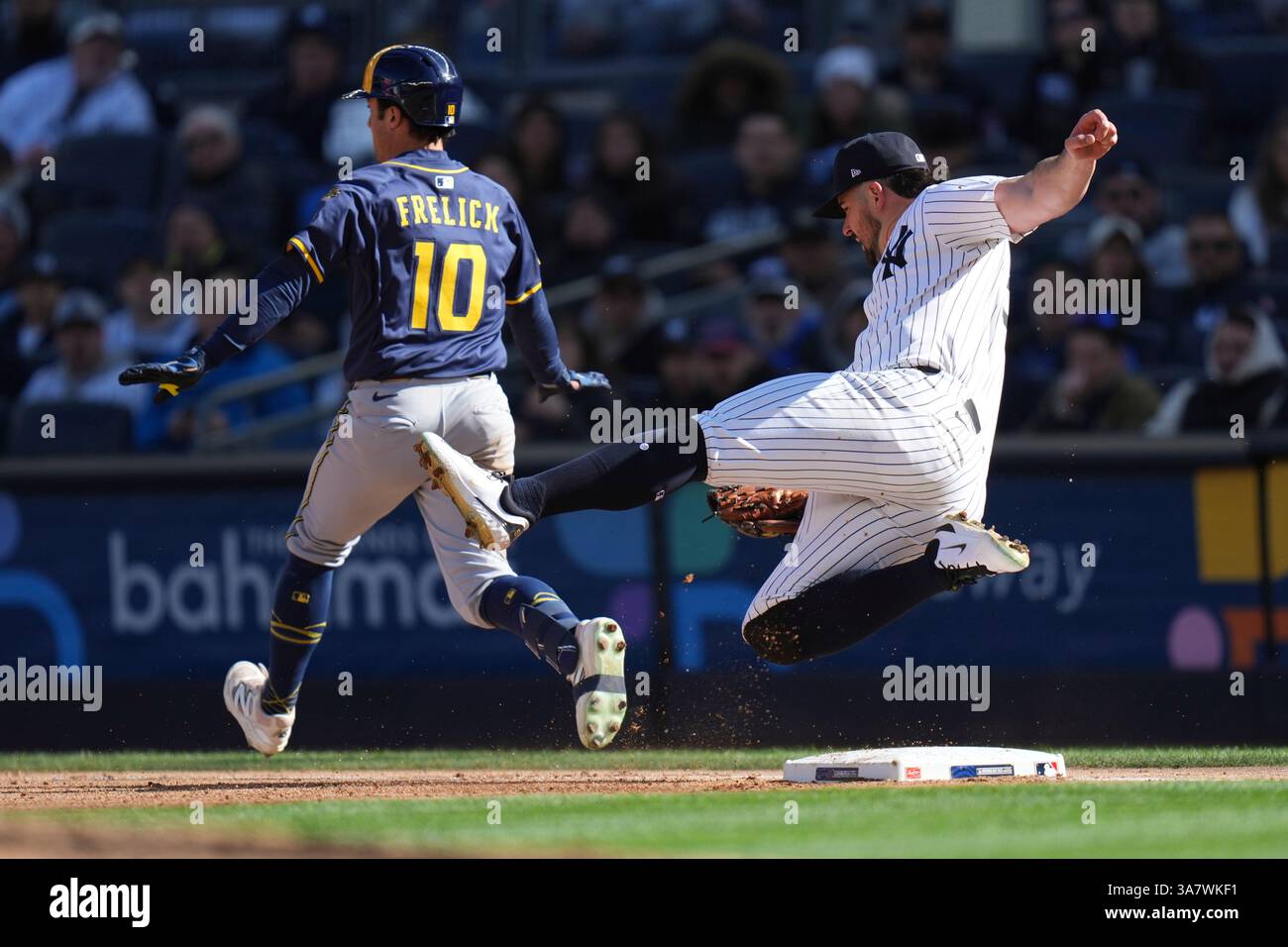 Milwaukee Brewers' Sal Frelick (10) beats New York Yankees pitcher ...