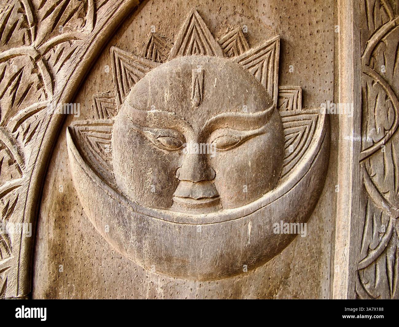 Sun and moon carving on 17th-century wooden palace door in Patan, Nepal ...