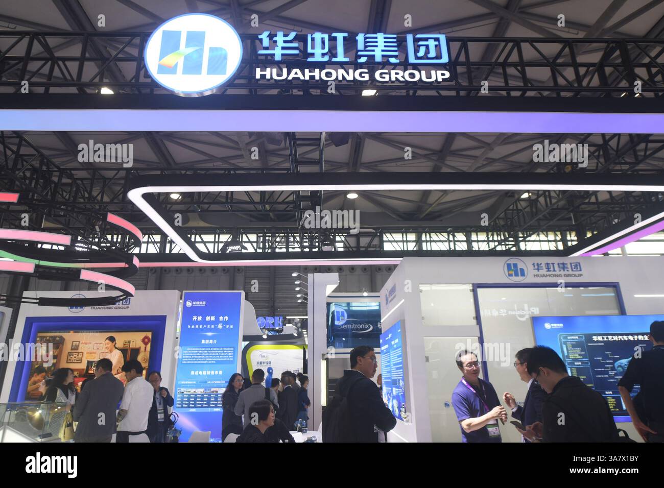 SHANGHAI, CHINA - MARCH 26, 2025 - Visitors visit the stand of Huahong Group at SEMICON China ...