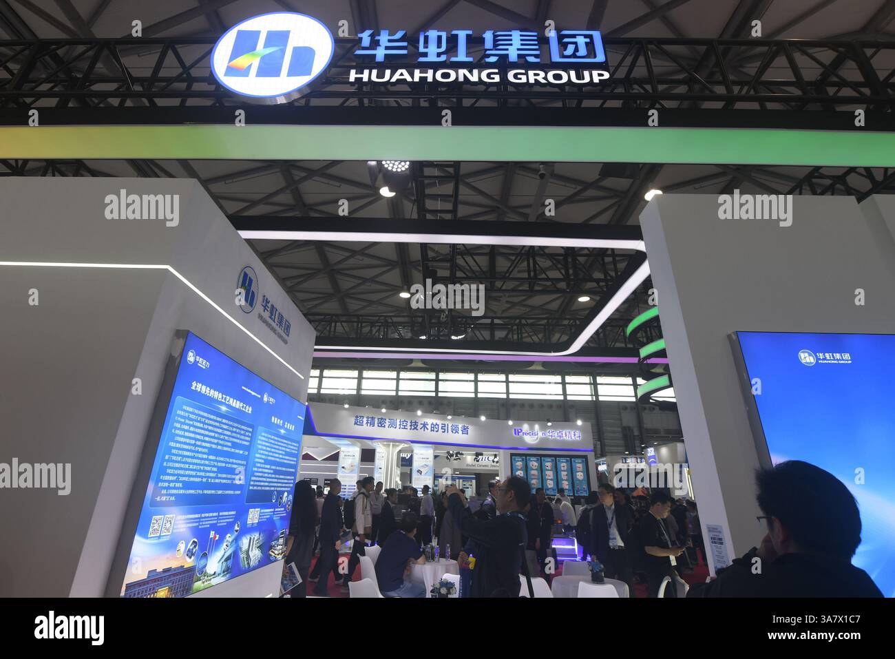 SHANGHAI, CHINA - MARCH 26, 2025 - Visitors visit the stand of Huahong Group at SEMICON China ...